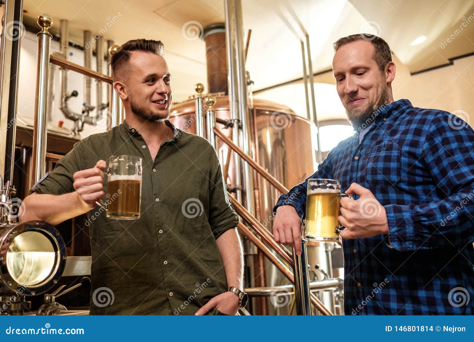 Two Men Tasting Fresh Beer in a Brewery Stock Photo - Image of ...