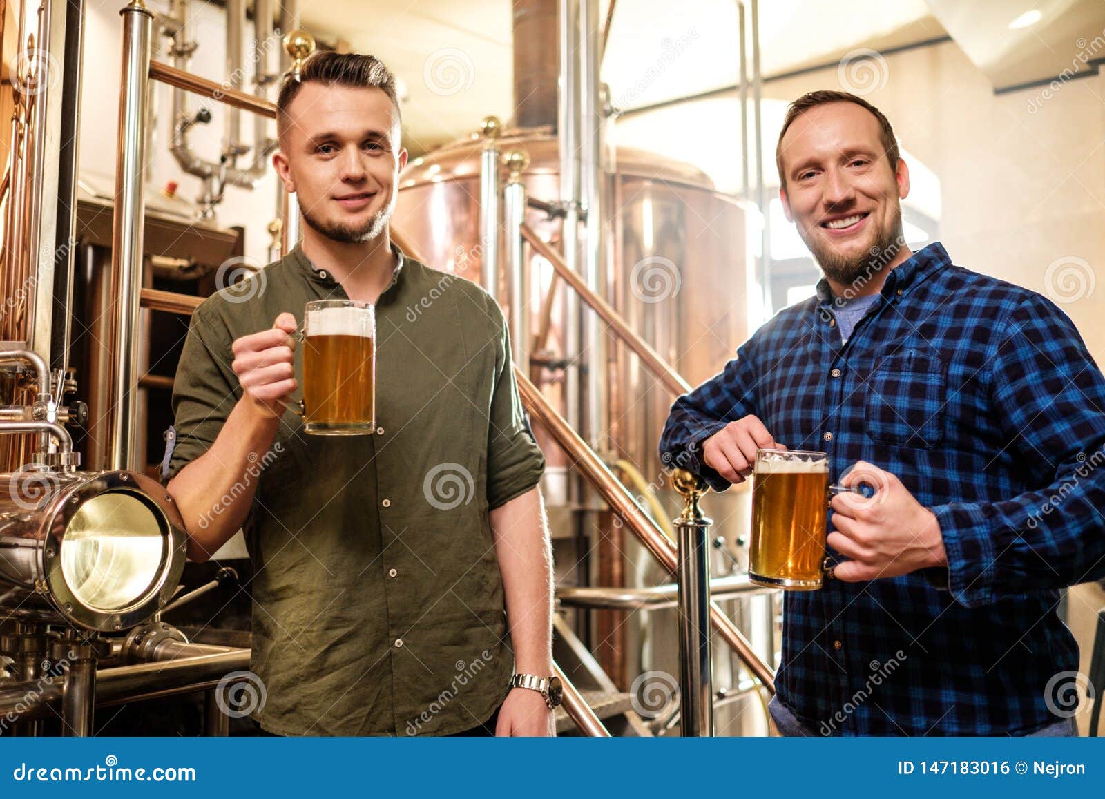 Two Men Tasting Fresh Beer in a Brewery Stock Photo - Image of machine ...