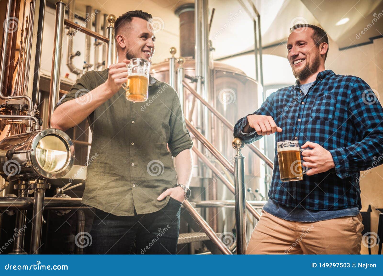 Two Men Tasting Fresh Beer in a Brewery Stock Image - Image of brewing ...