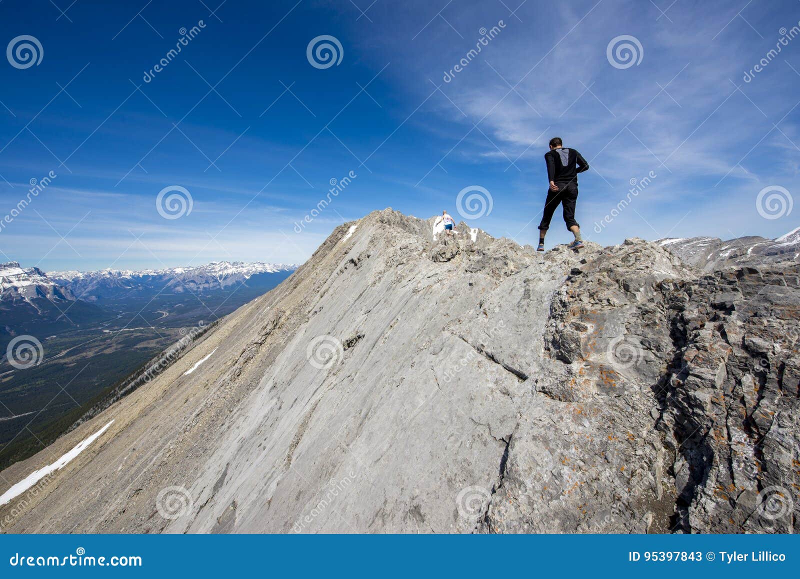 Two Men Trail Running a Steep Ridge Line in the Mountains of Canada ...