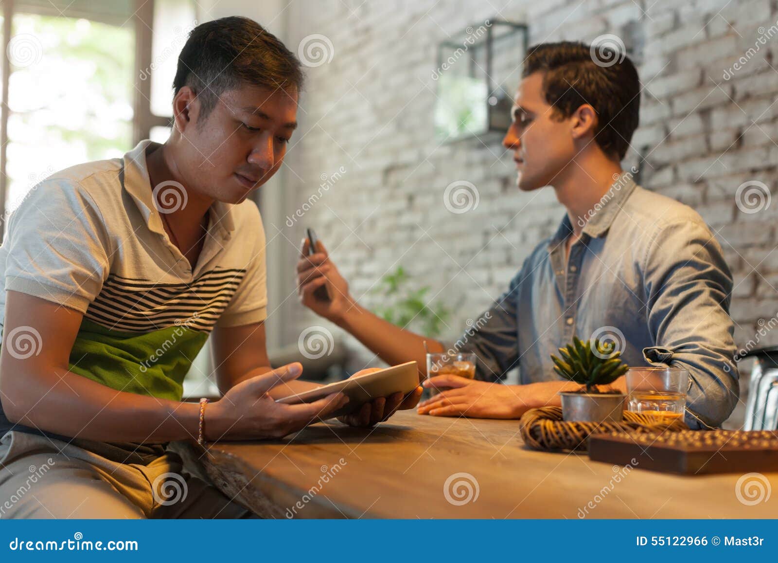 Two Men Using Internet Technology Tablet Computer Stock Photo - Image ...