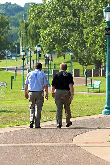 Two Men Walking stock photo. Image of appointment, outdoor - 1938466