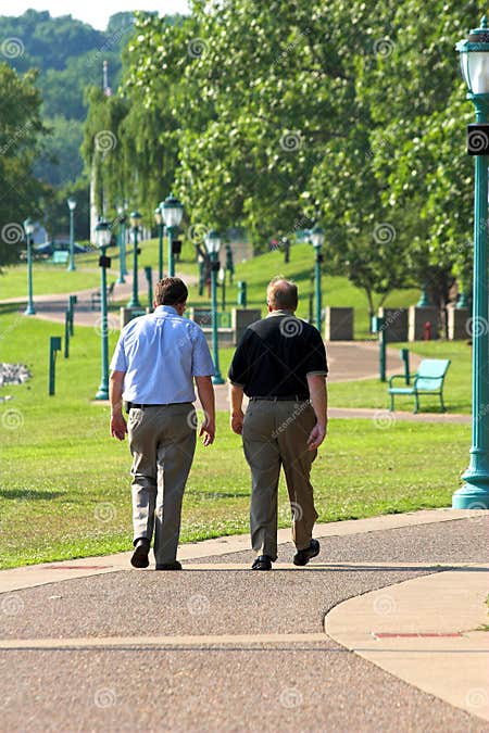 Two Men Walking stock photo. Image of appointment, outdoor - 1938466