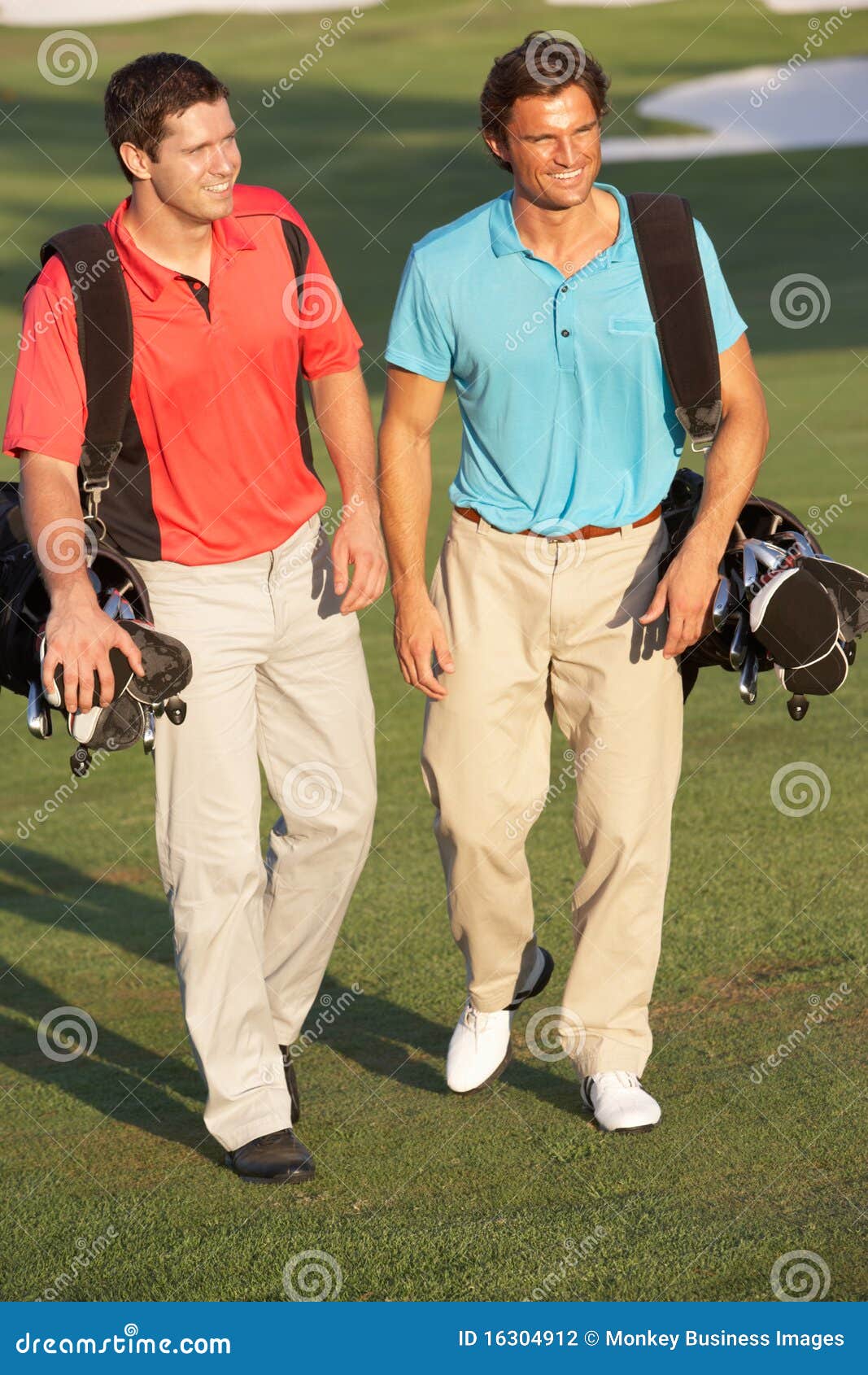 Two Men Walking Along Golf Course Stock Photo - Image of person, golf ...