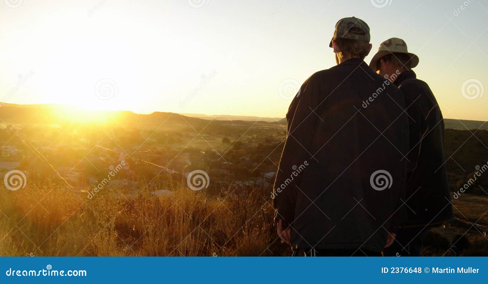 Two Men Watching Sunset stock photo. Image of adults, buddies - 2376648