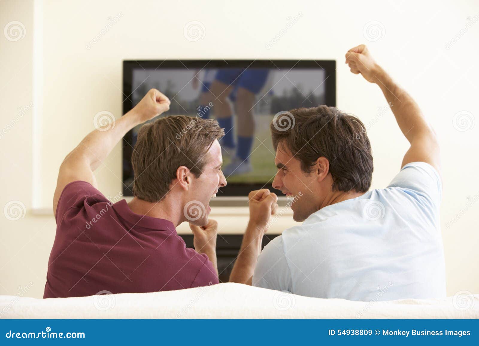 Two Men Watching Widescreen TV at Home Stock Image - Image of relaxing ...