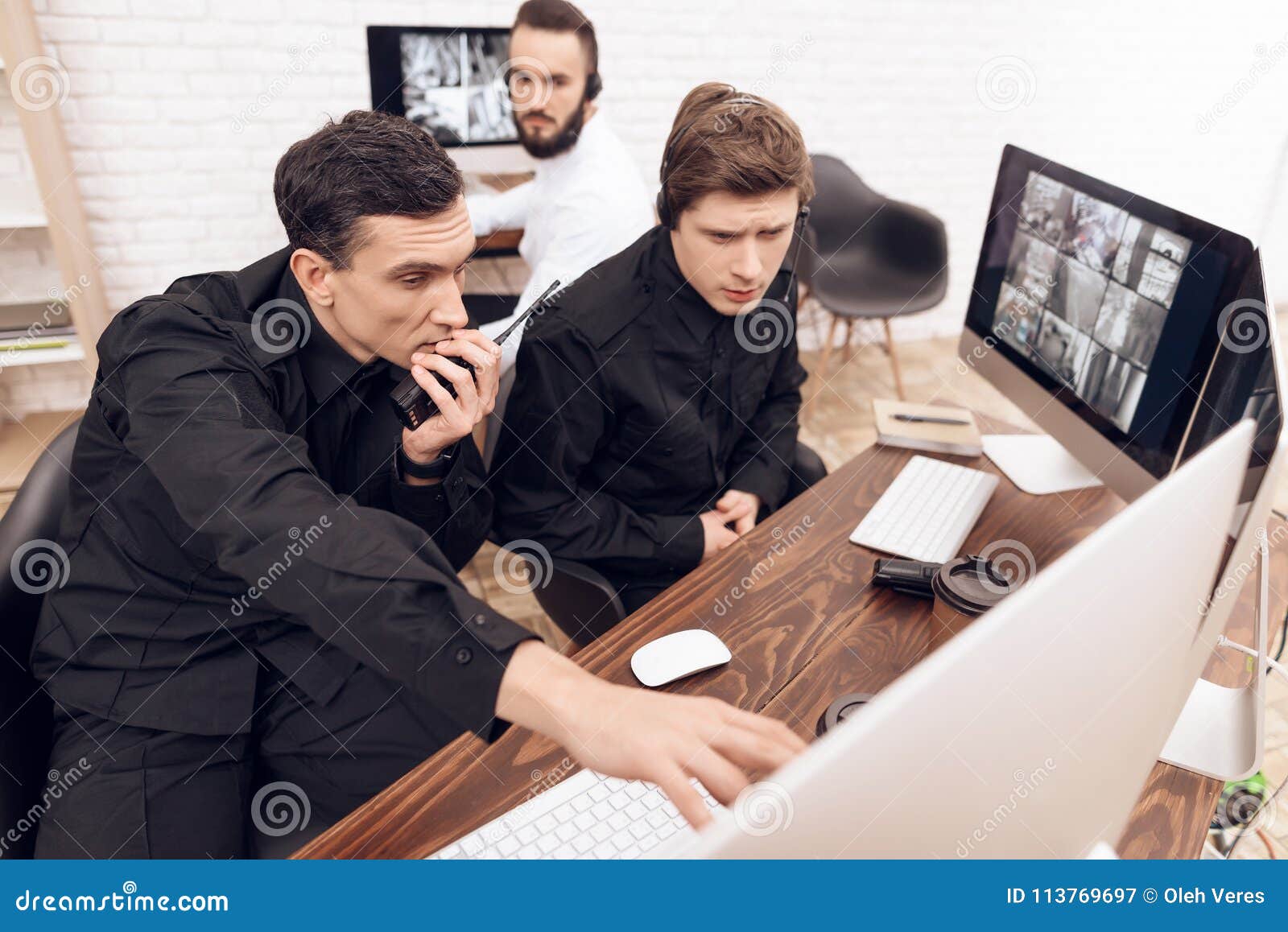 Two men work as guards. stock image. Image of office - 113769697