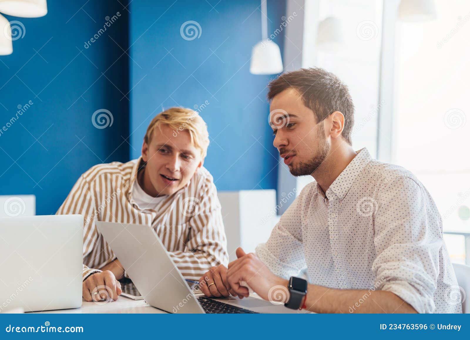 Two Men Work in Office Using Laptop Stock Photo - Image of teamwork ...