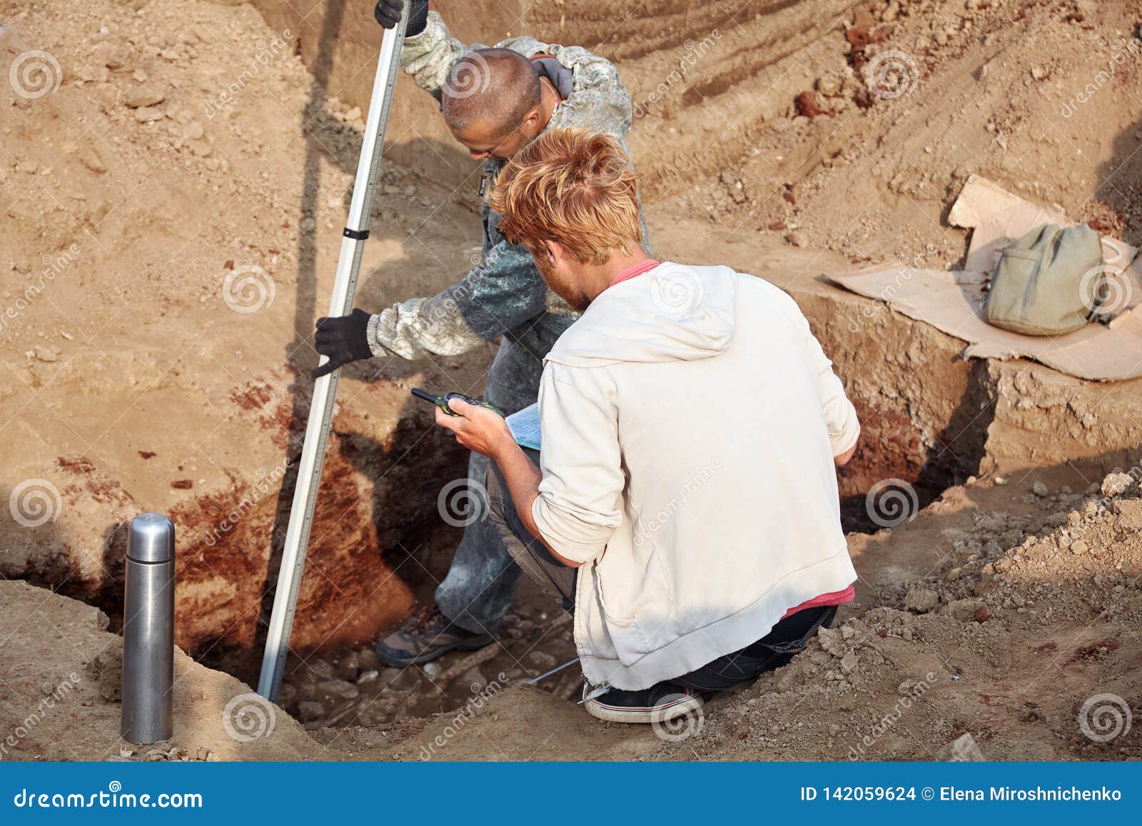 Two Men at Work Outdoors, in Digger Process. Archaeological Excavations ...