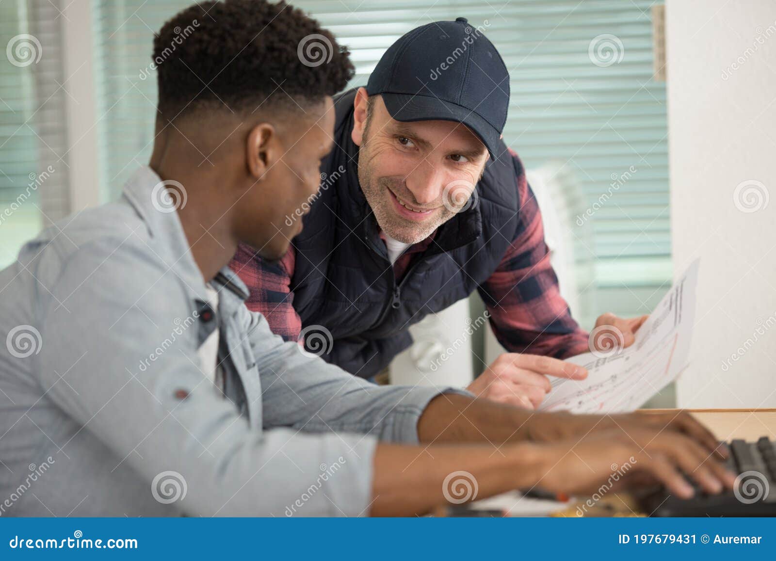 Two men work in studio stock image. Image of inside - 197679431