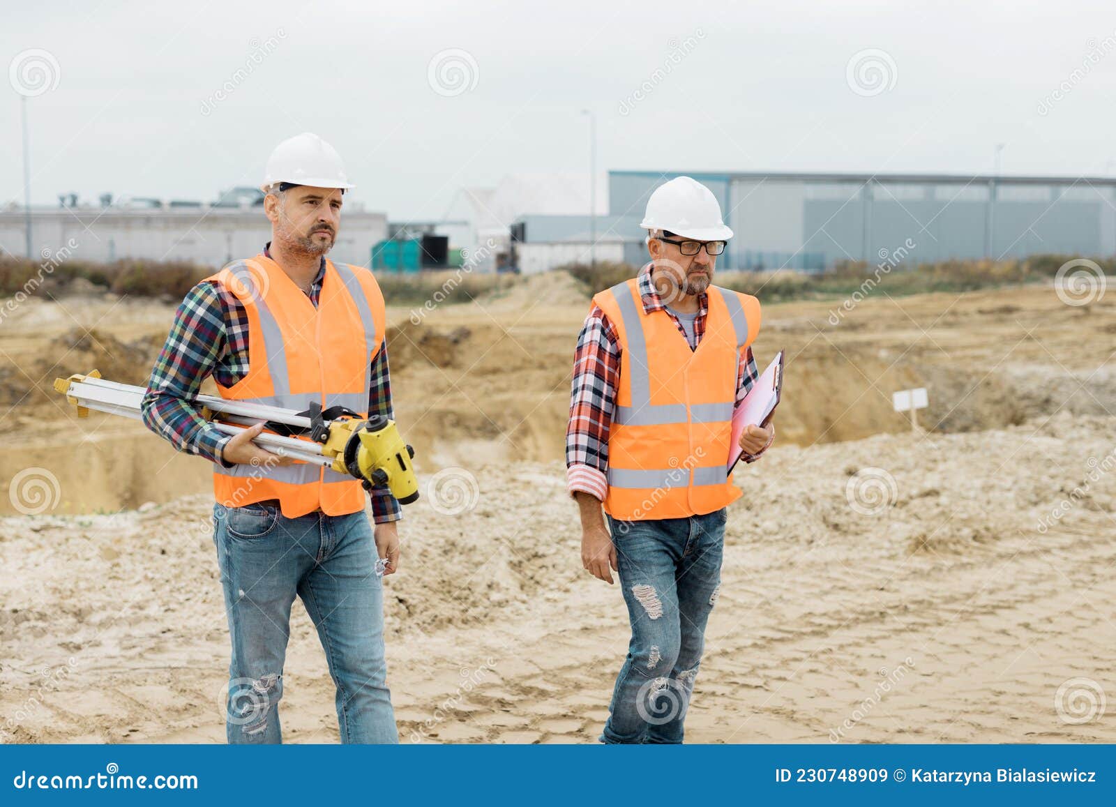 Two men at work stock image. Image of device, uniform - 230748909