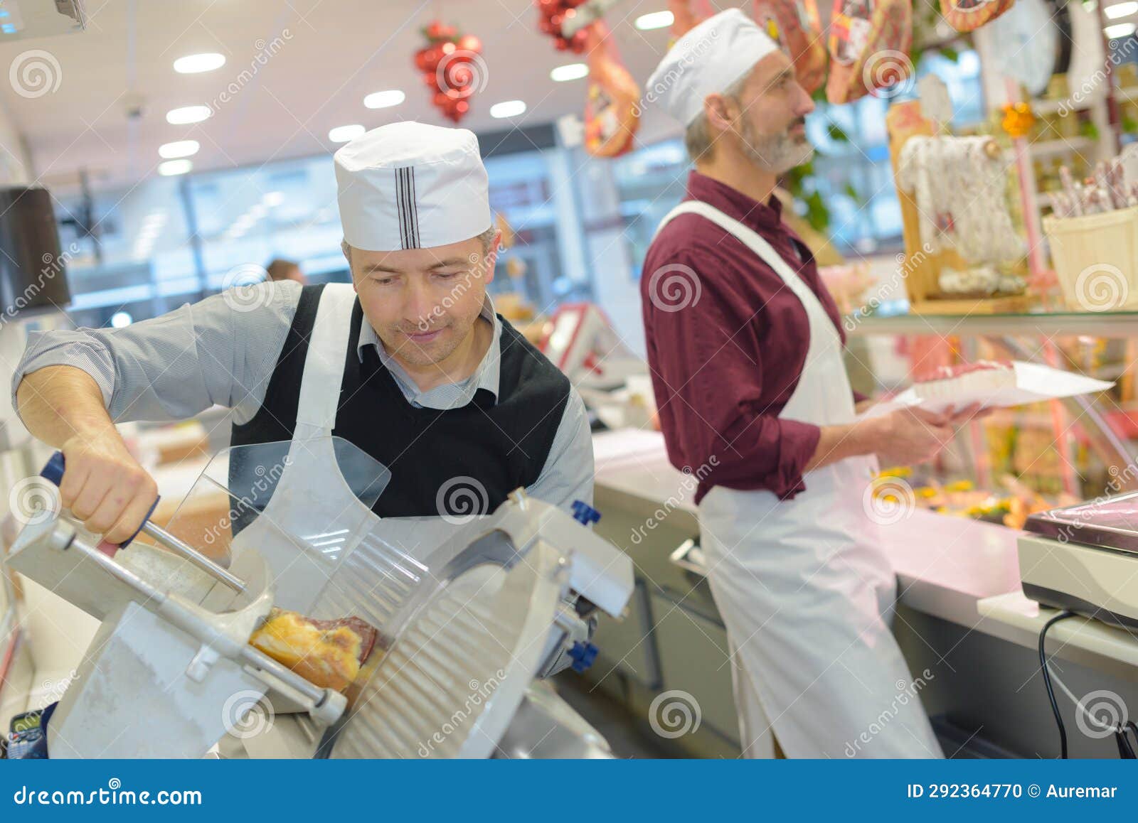 Two Men Working Behind Counter in Delicatessen Stock Photo - Image of ...
