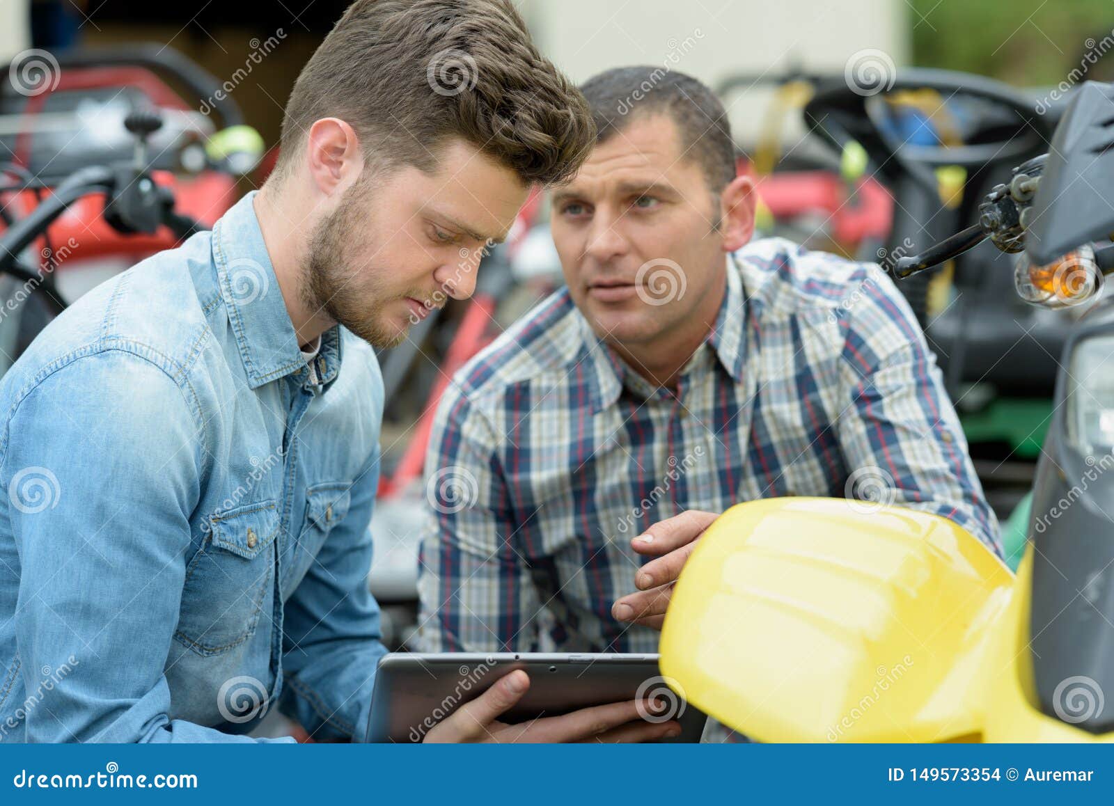 Two men working at factory stock photo. Image of sweeping - 149573354