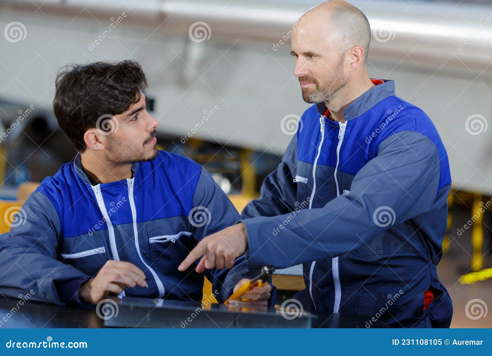 Two men working at factory stock image. Image of lifestyle - 231108105