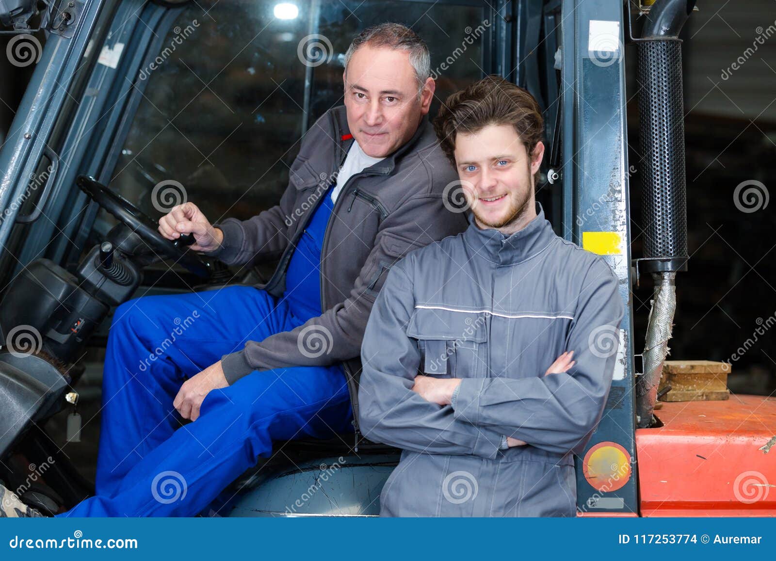 Two men working in factory stock photo. Image of owner - 117253774