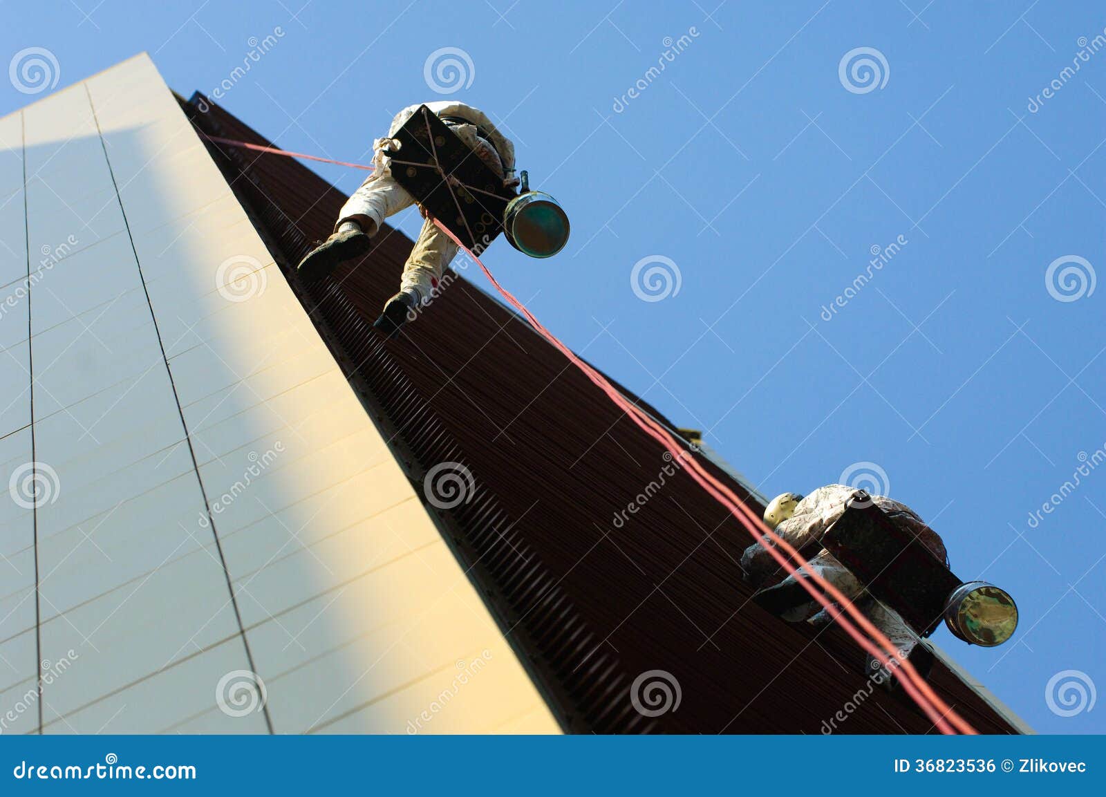 Two men working on height stock photo. Image of concrete - 36823536