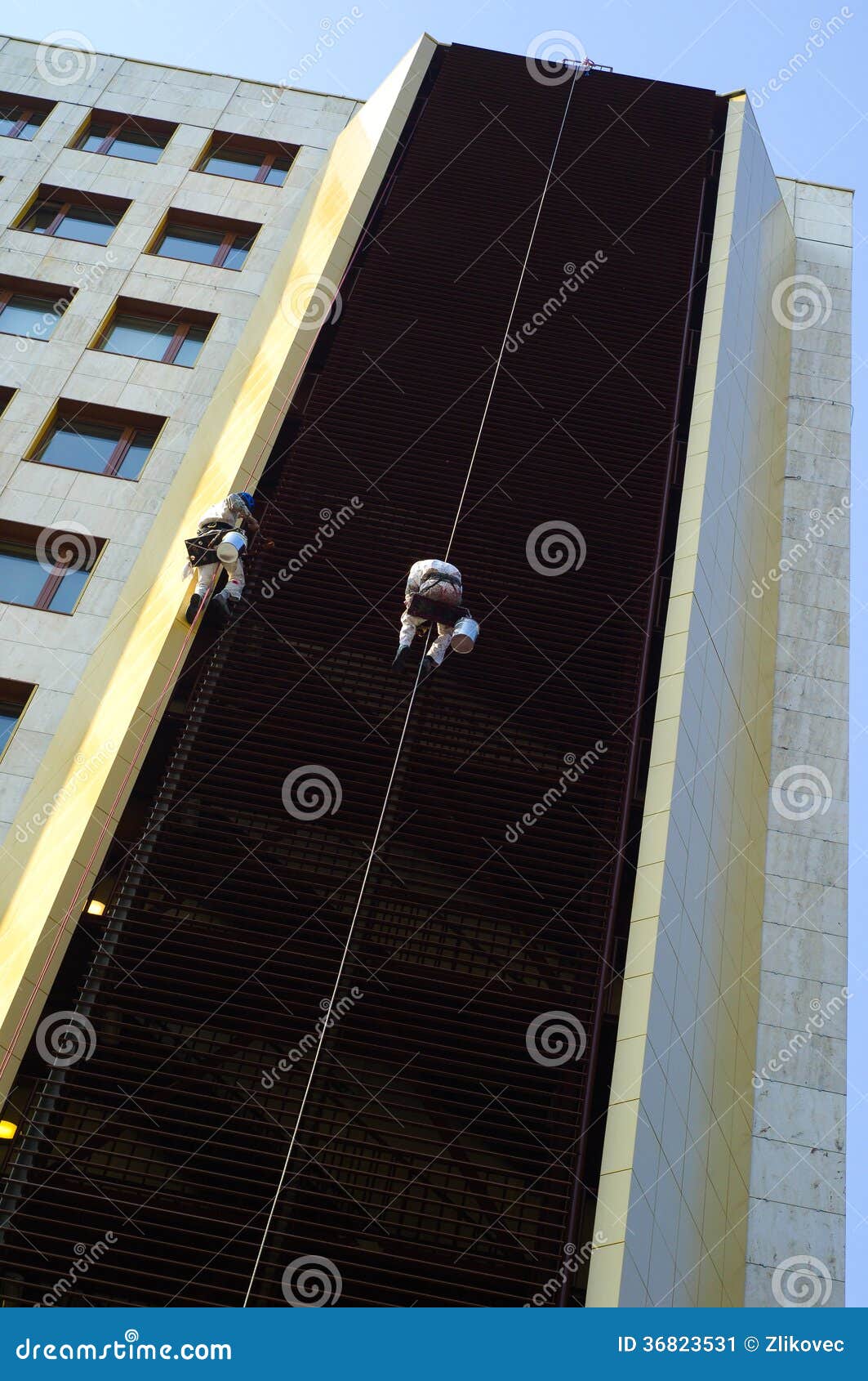 Two men working high stock image. Image of hights, dangle - 36823531