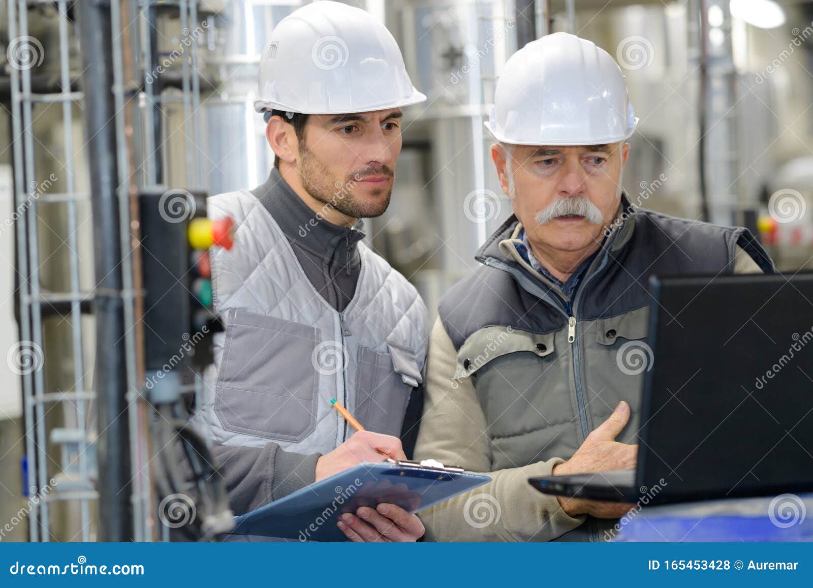 Two Men Working with Laptop in Factory Stock Photo - Image of collar ...