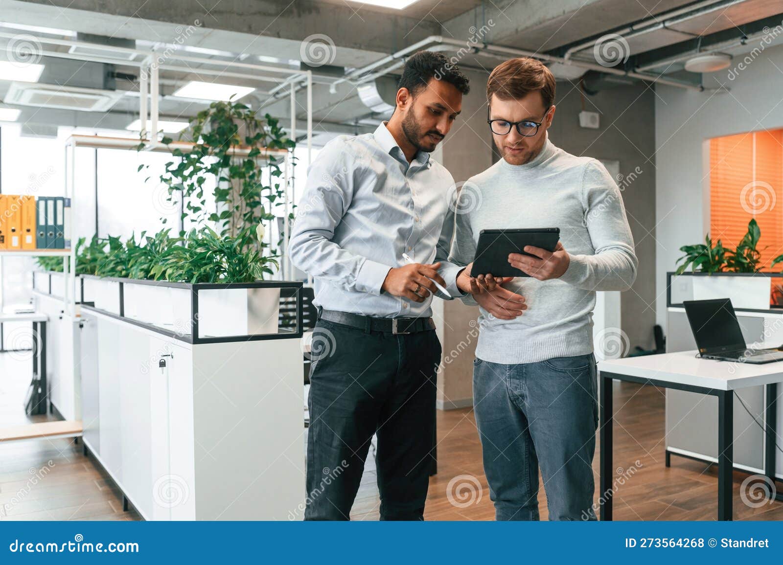 Two Men are Working in the Modern Office Together Stock Photo - Image ...