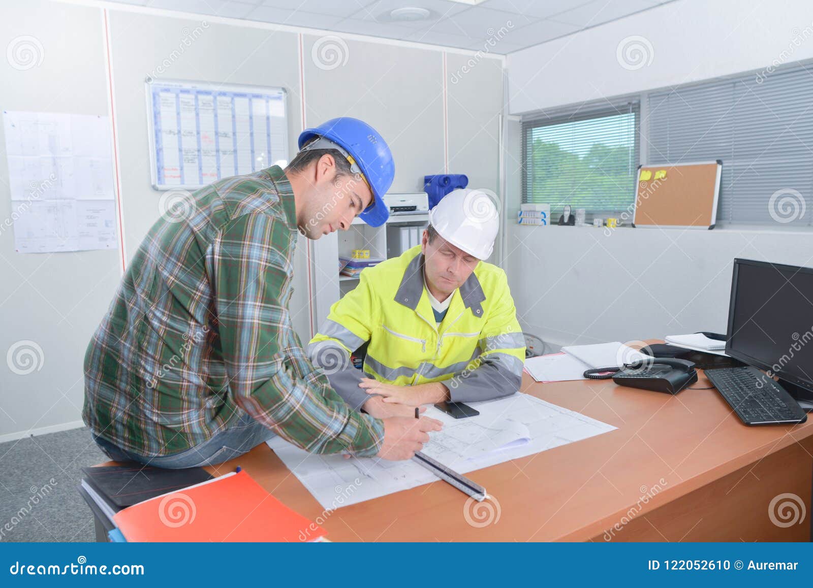Two Men Working on Scale Drawings One Sat on Table Stock Photo - Image ...