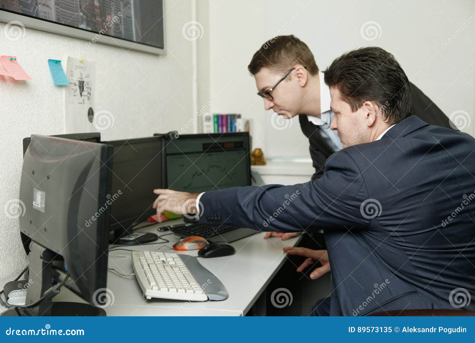 Two Men Working Together for the Computers in the Office Engaged in ...