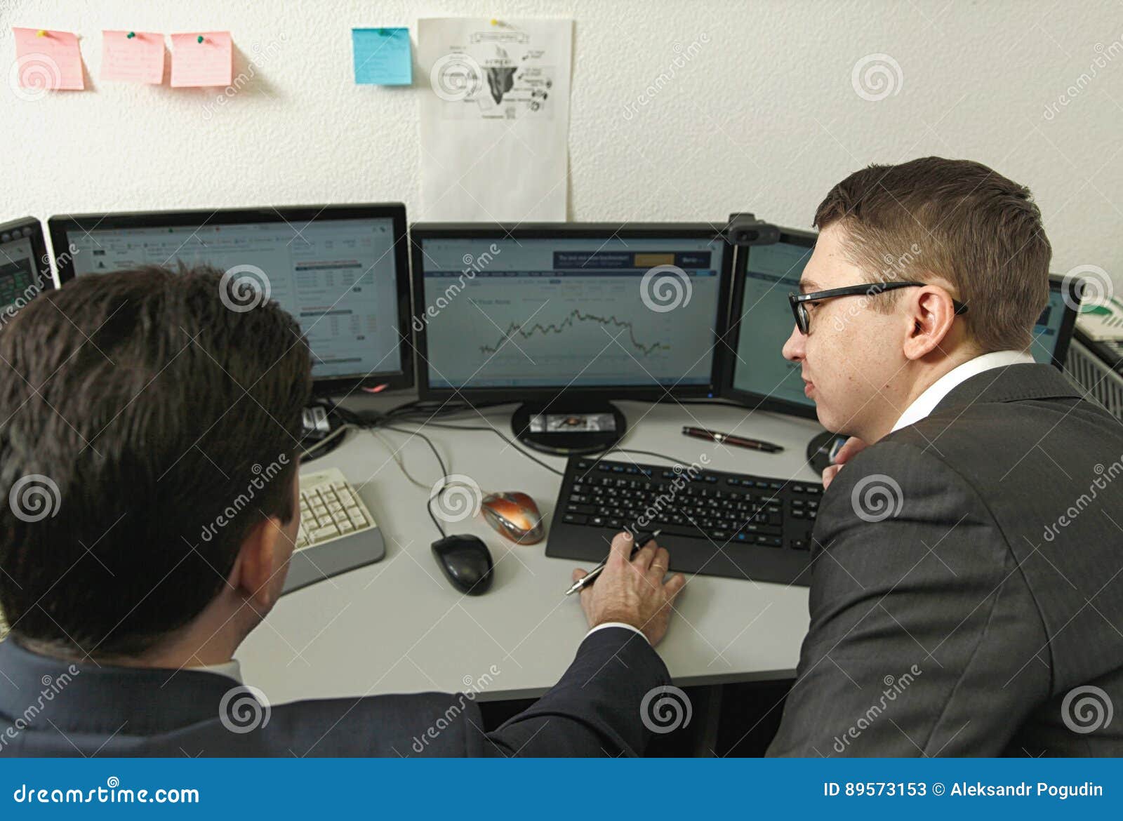 Two Men Working Together for the Computers in the Office Engaged in ...