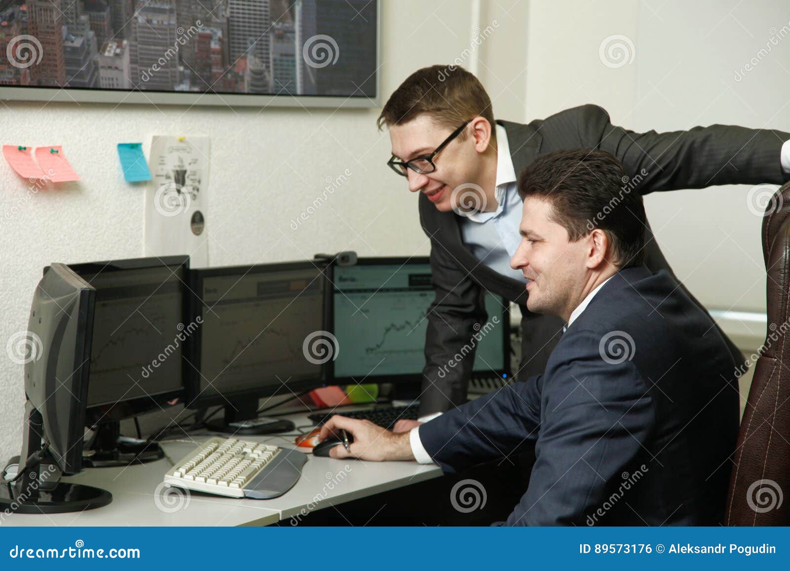 Two Men Working Together for the Computers in the Office Engaged in ...