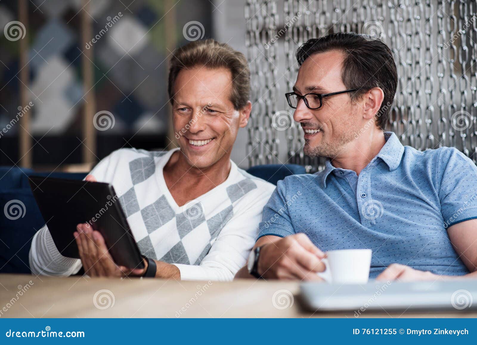 Two men working together stock image. Image of drink - 76121255
