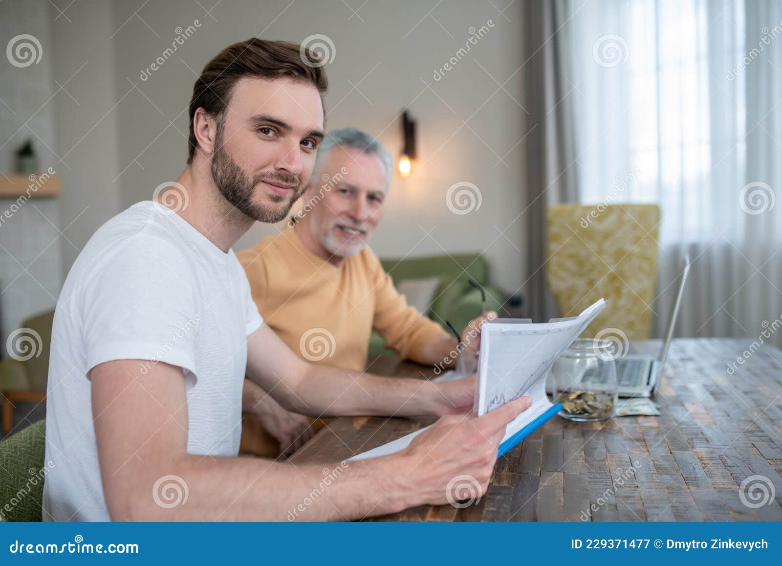 Two Men Working Together on a Project and Looking Interested Stock ...