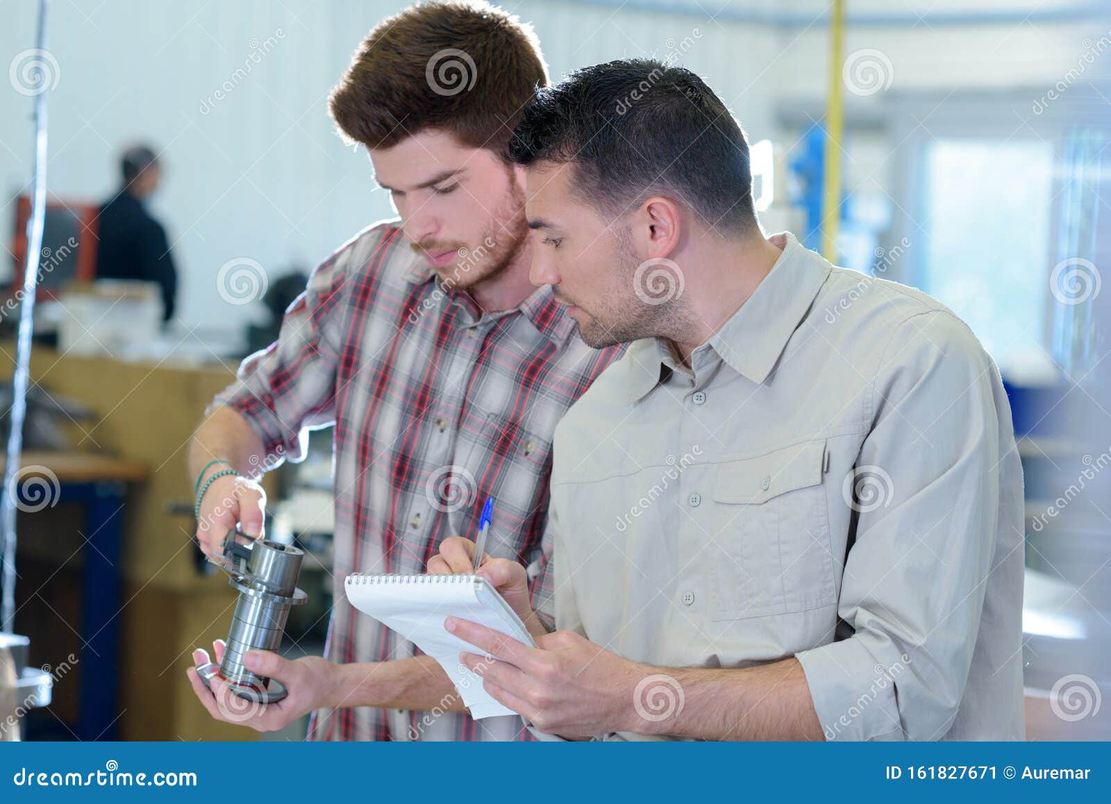Two Men Working Together in Workshop Stock Image - Image of machine ...