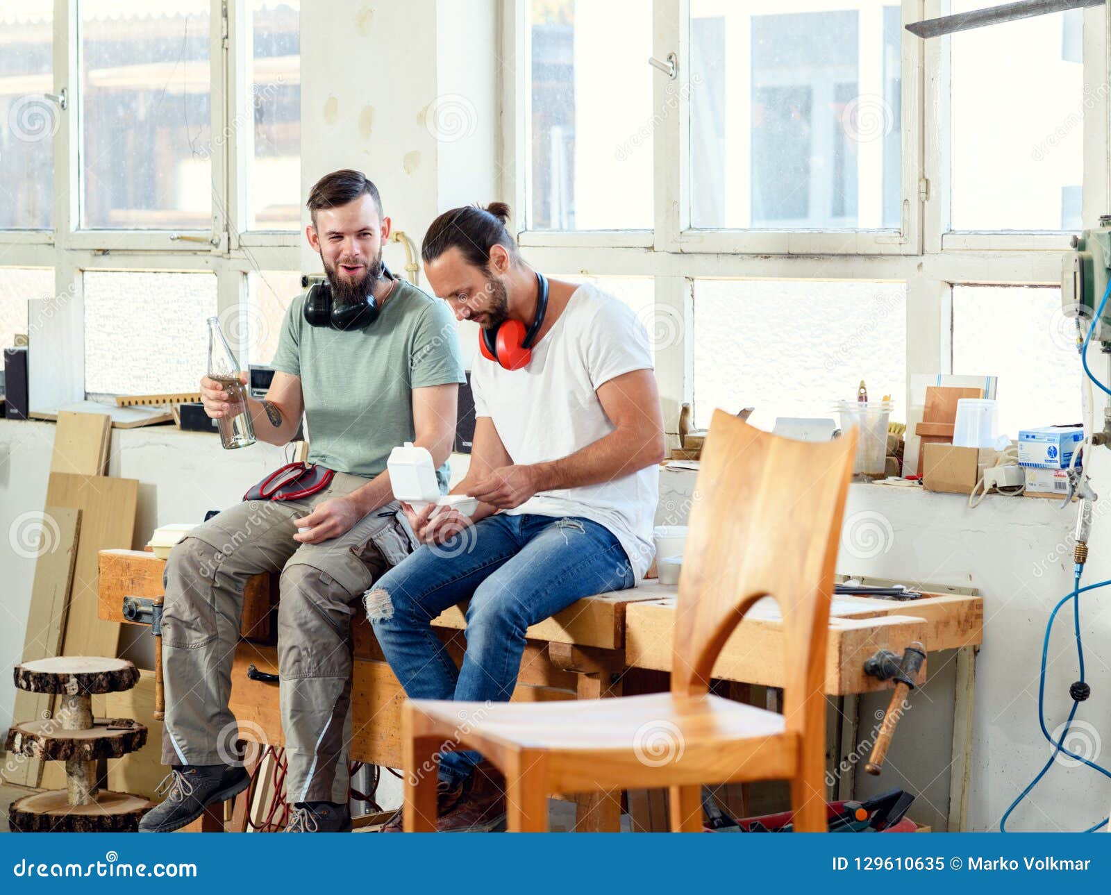 Two Worker in a Carpenters Workshop Taking a Break Stock Image - Image ...
