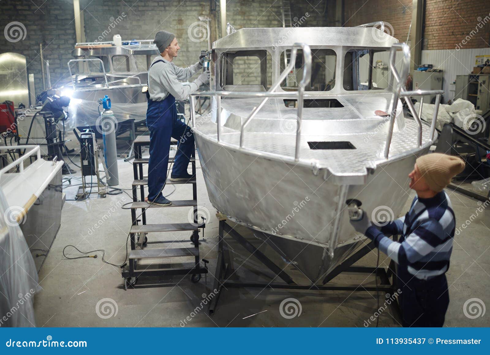 Men making boat stock image. Image of colleagues, assistant - 113935437