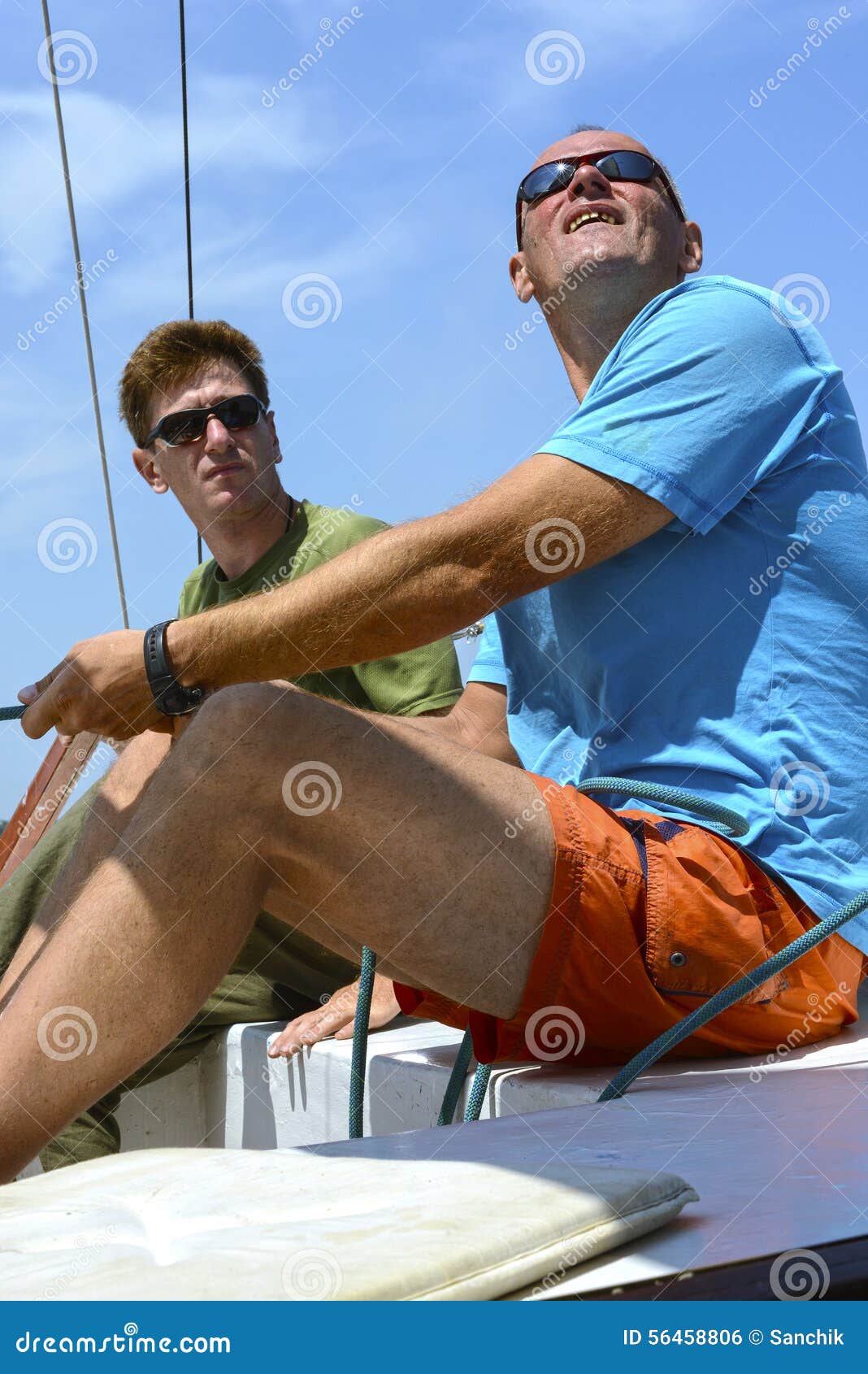Two men on yacht stock photo. Image of joyful, adventures - 56458806