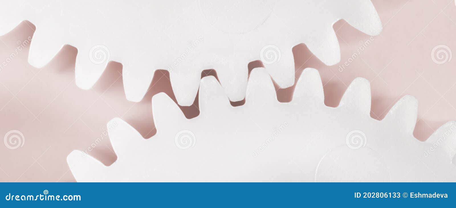 Two meshed gears on beige stock image. Image of long - 202806133