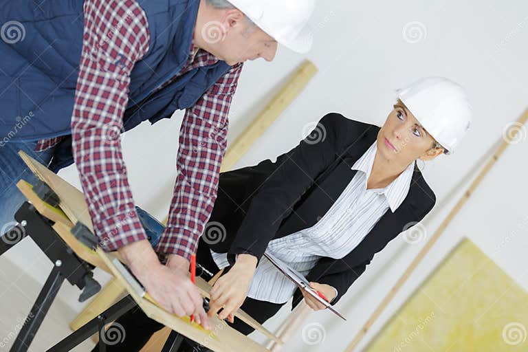 Two Middle Age Building Interior Designers Discuss Stock Photo - Image ...
