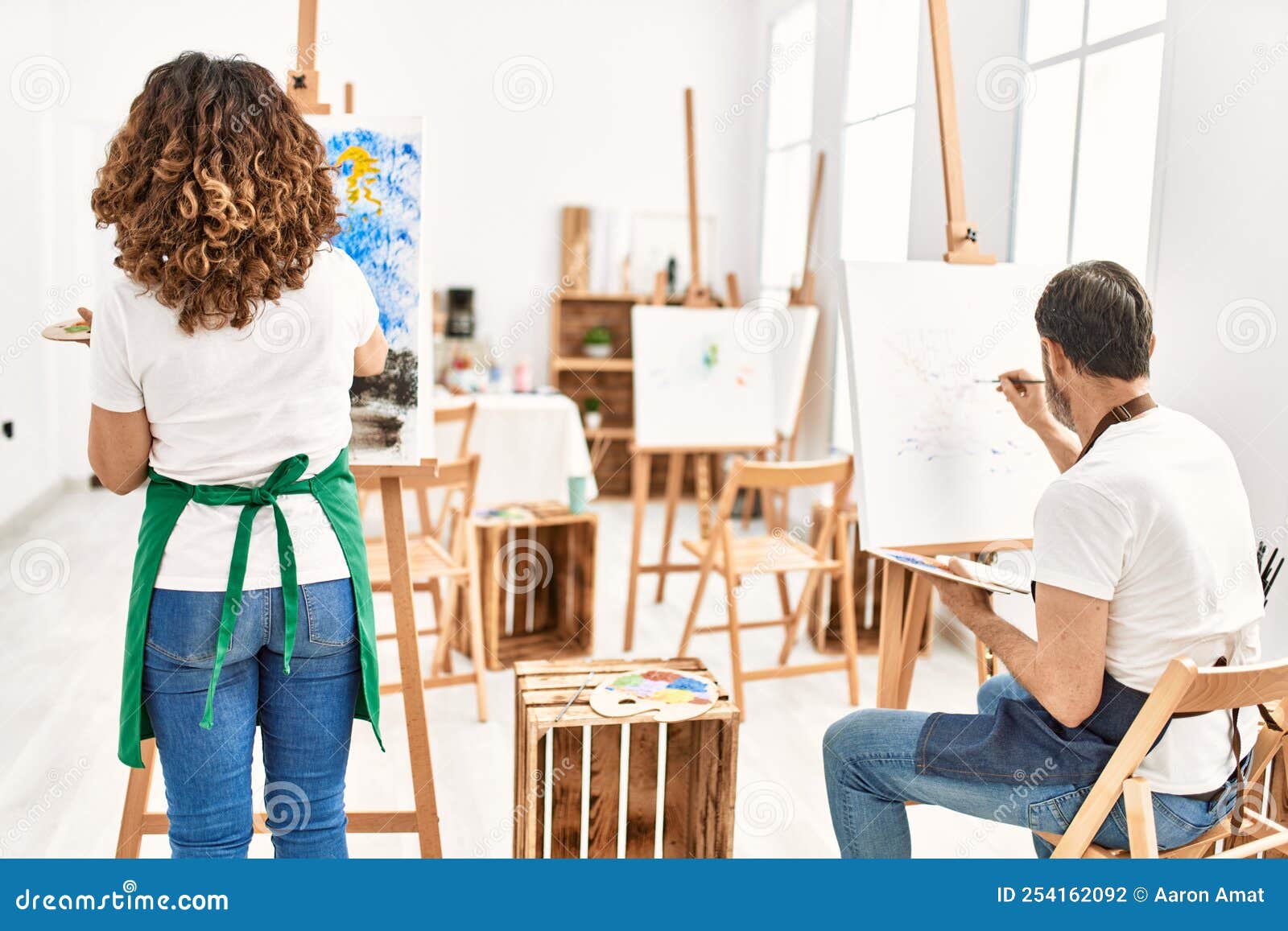 Two Middle Age Student on Back View Painting at Art Studio Stock Photo ...