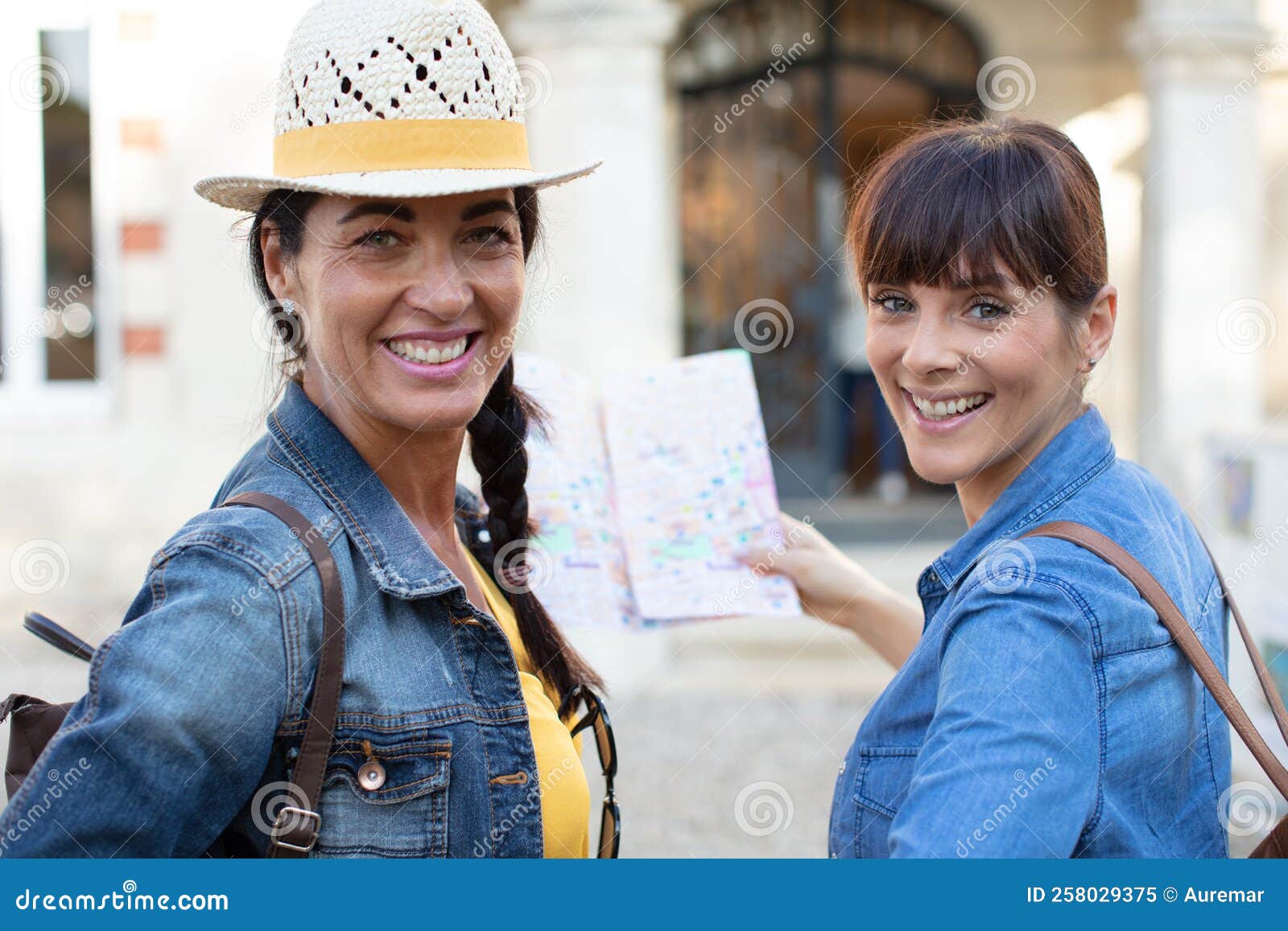 Two Middle-aged Women Look at Map while on City Break Stock Image ...