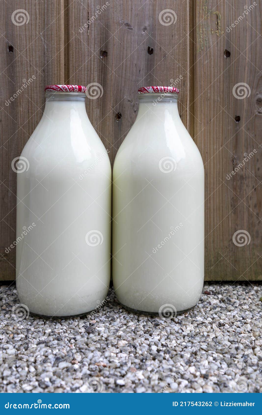 Two Milk Bottles on a Doorstep Stock Photo - Image of reduce, pair ...