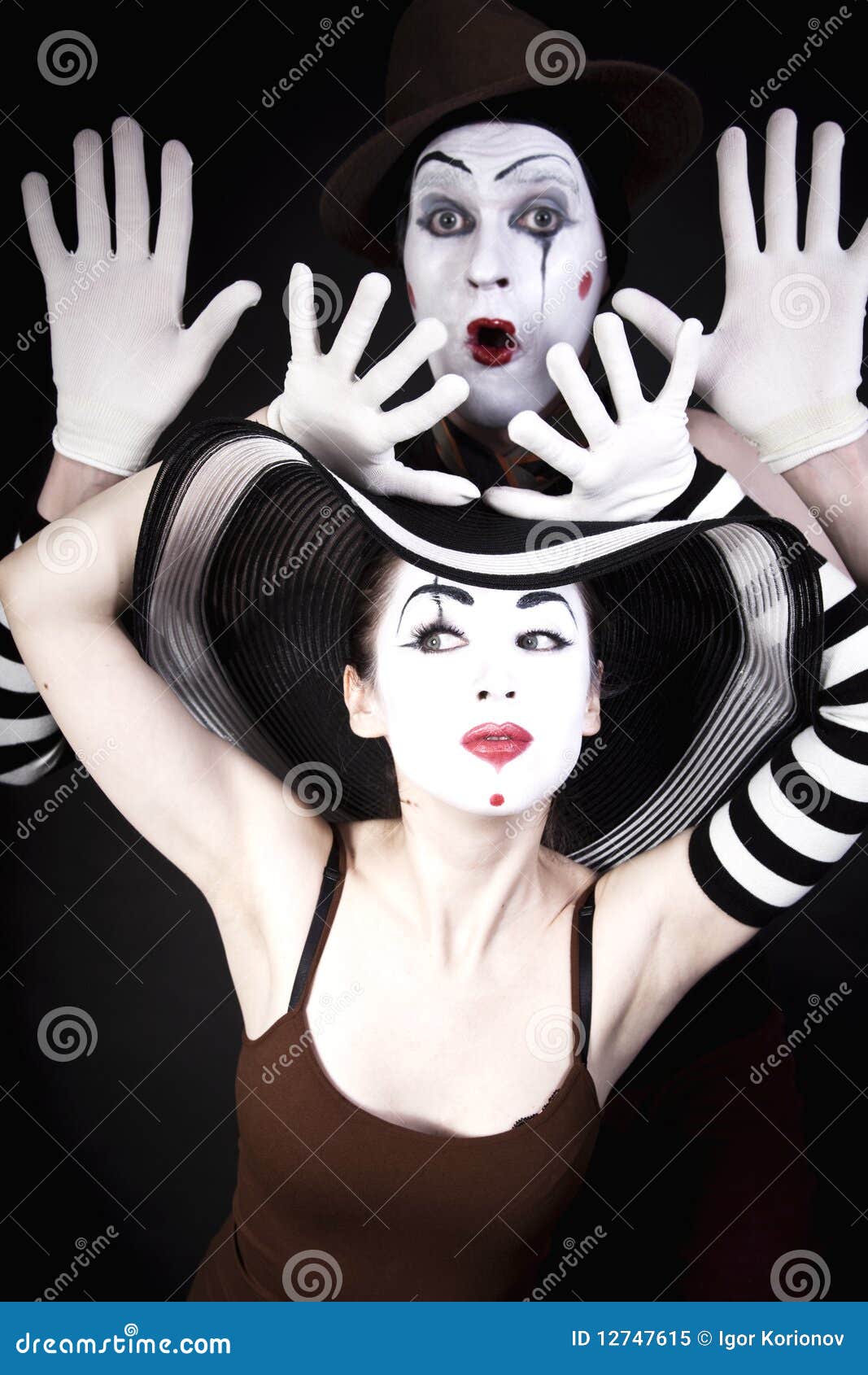 Two Mimes in Hats on Black Background Stock Image - Image of white ...
