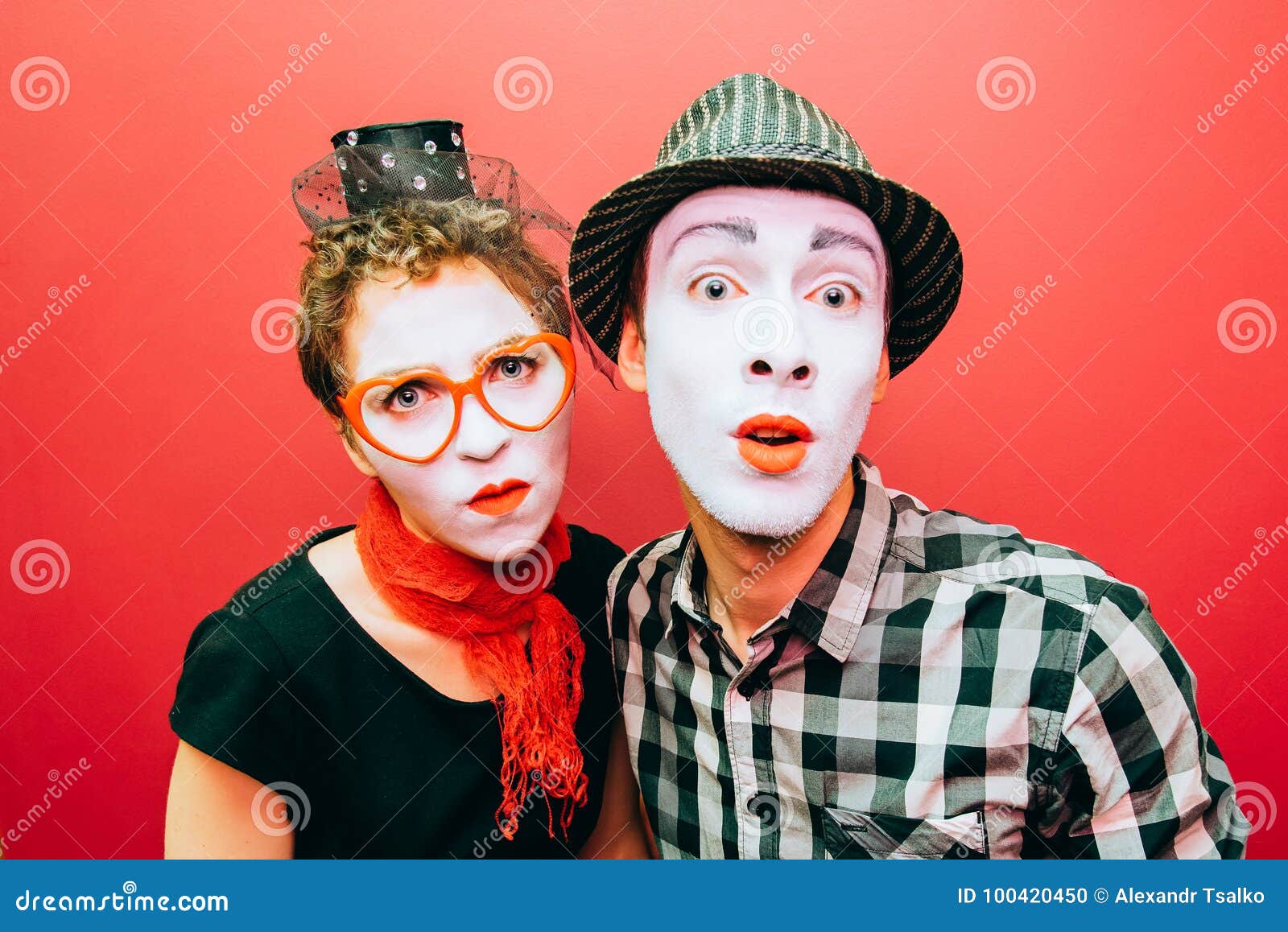 Two Mimes Posing Against a Red Wall Background Stock Photo - Image of ...