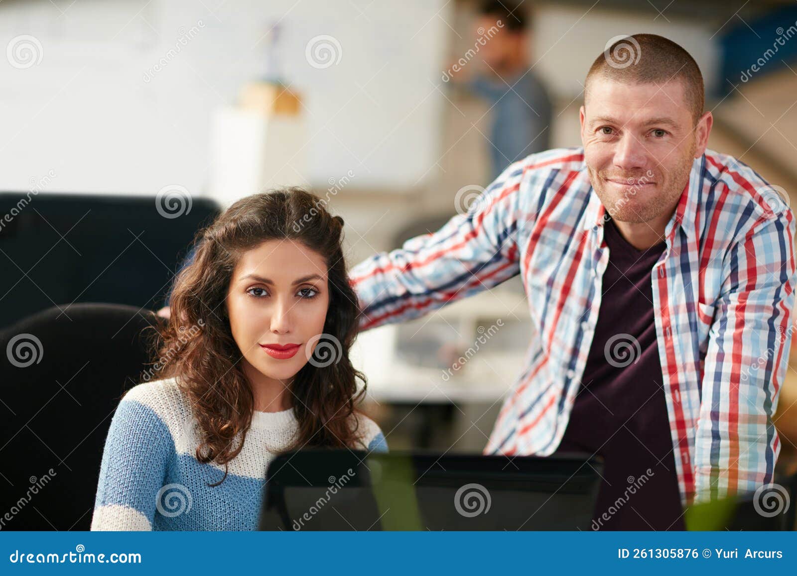 Two Minds To Create a Winning Design. Two Coworkers Using a Computer ...