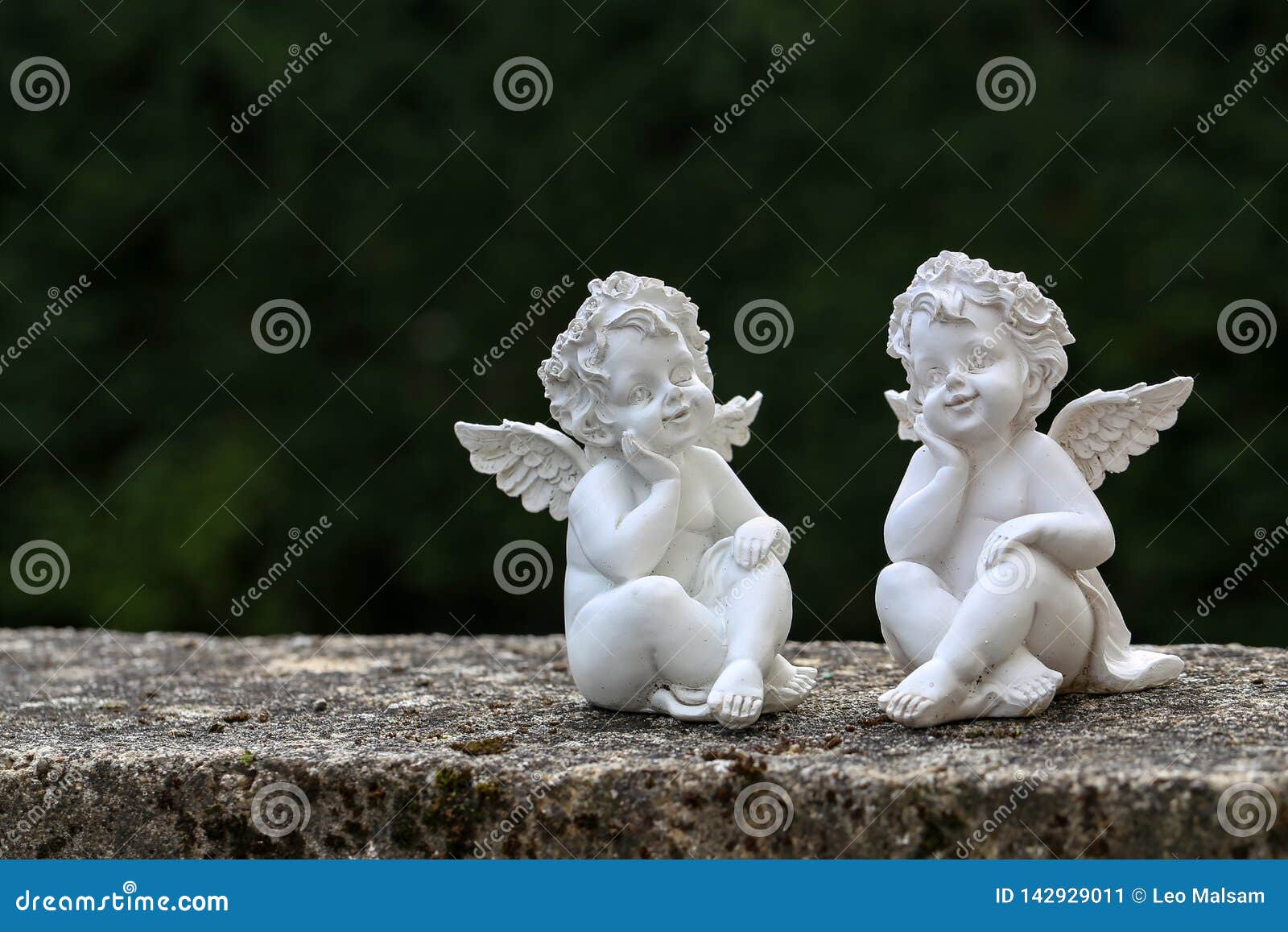 Two Miniature Angels on a Stone Wall Stock Image - Image of family ...