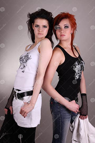 Two Models in Colorful Setting in the Studio Stock Image - Image of ...