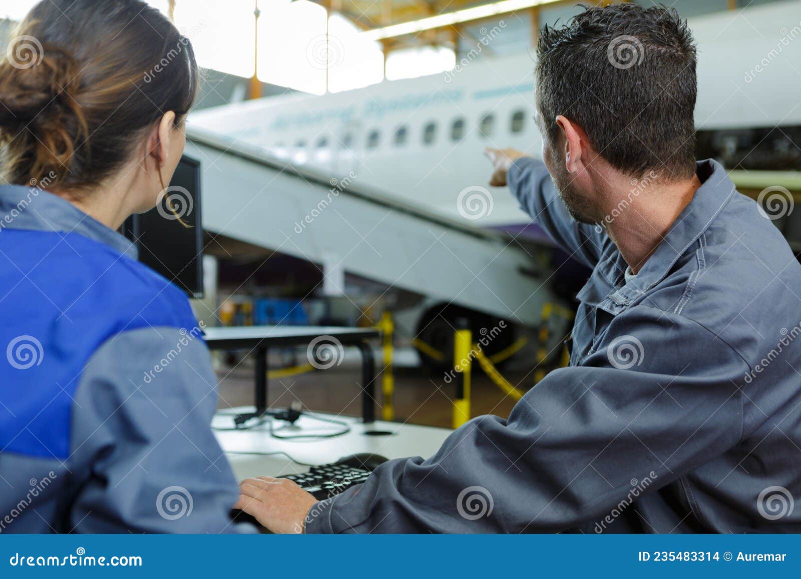 Two Modern Aircraft Engineers Pointing Airplane Stock Photo - Image of ...