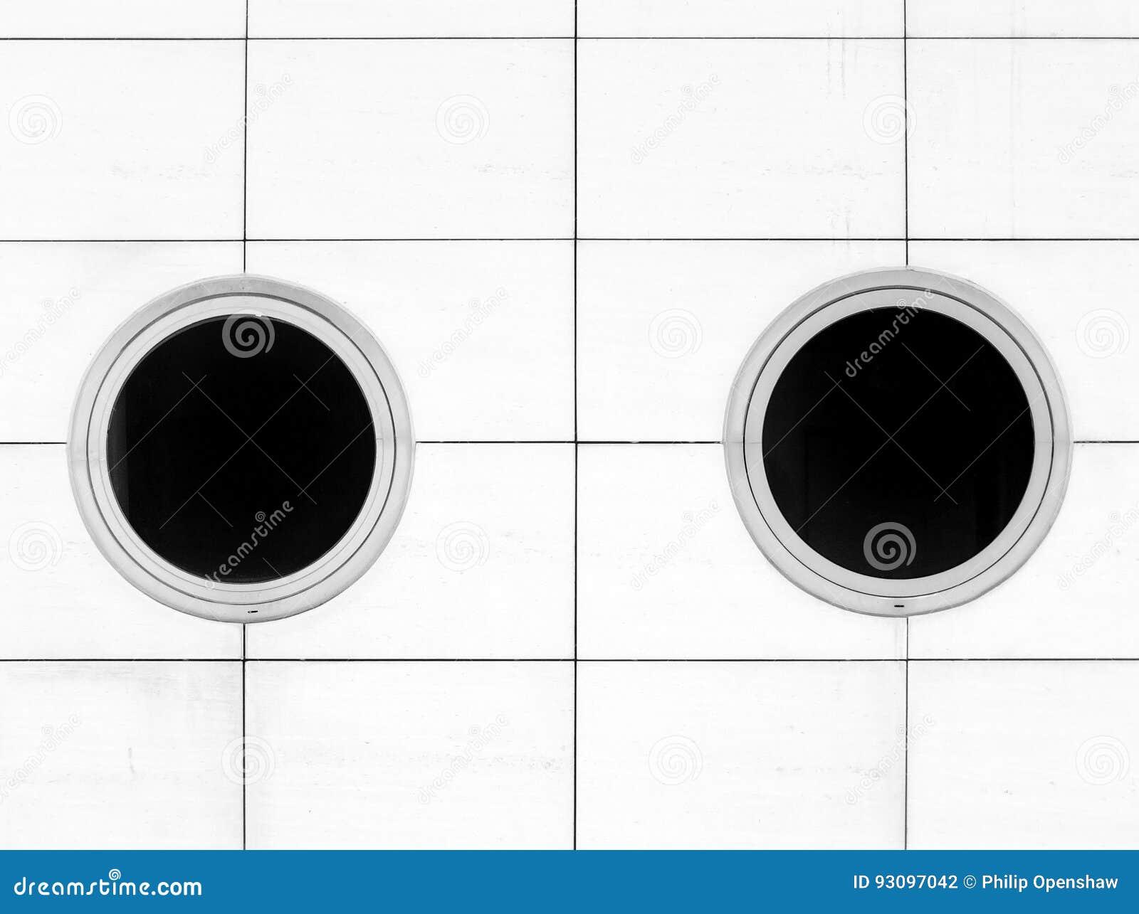 Two Modern Round Windows on a White Tiled Wall Stock Photo - Image of ...
