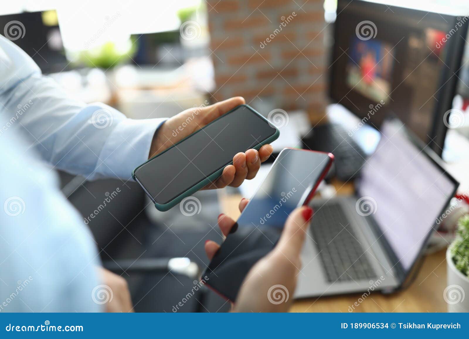 Two Modern Touch Phones are Held in Hands of Office. Stock Photo ...
