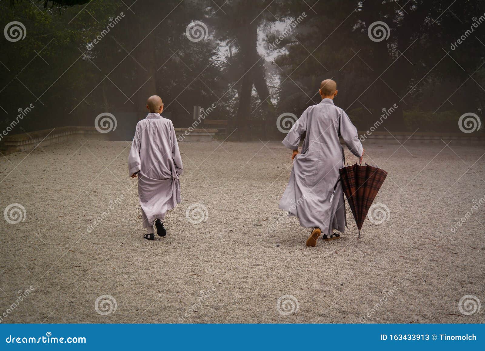 Two Monks with Umbrella at the Morning Prayer. Editorial Stock Photo ...