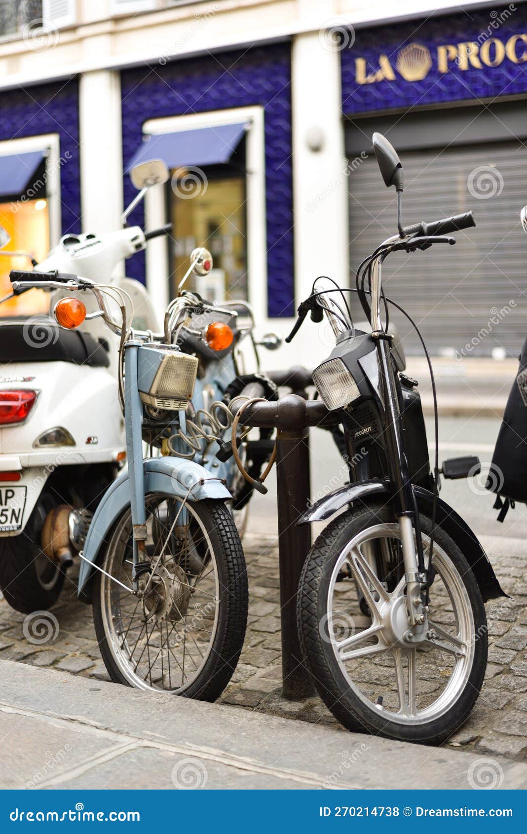 Two Mopeds Looking at Each Other Lovingly in Paris, France Stock Photo ...