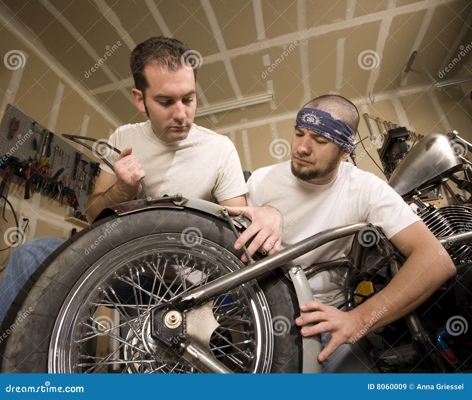 Two Motorcycle Mechanics Placing a Fender Stock Image - Image of ...