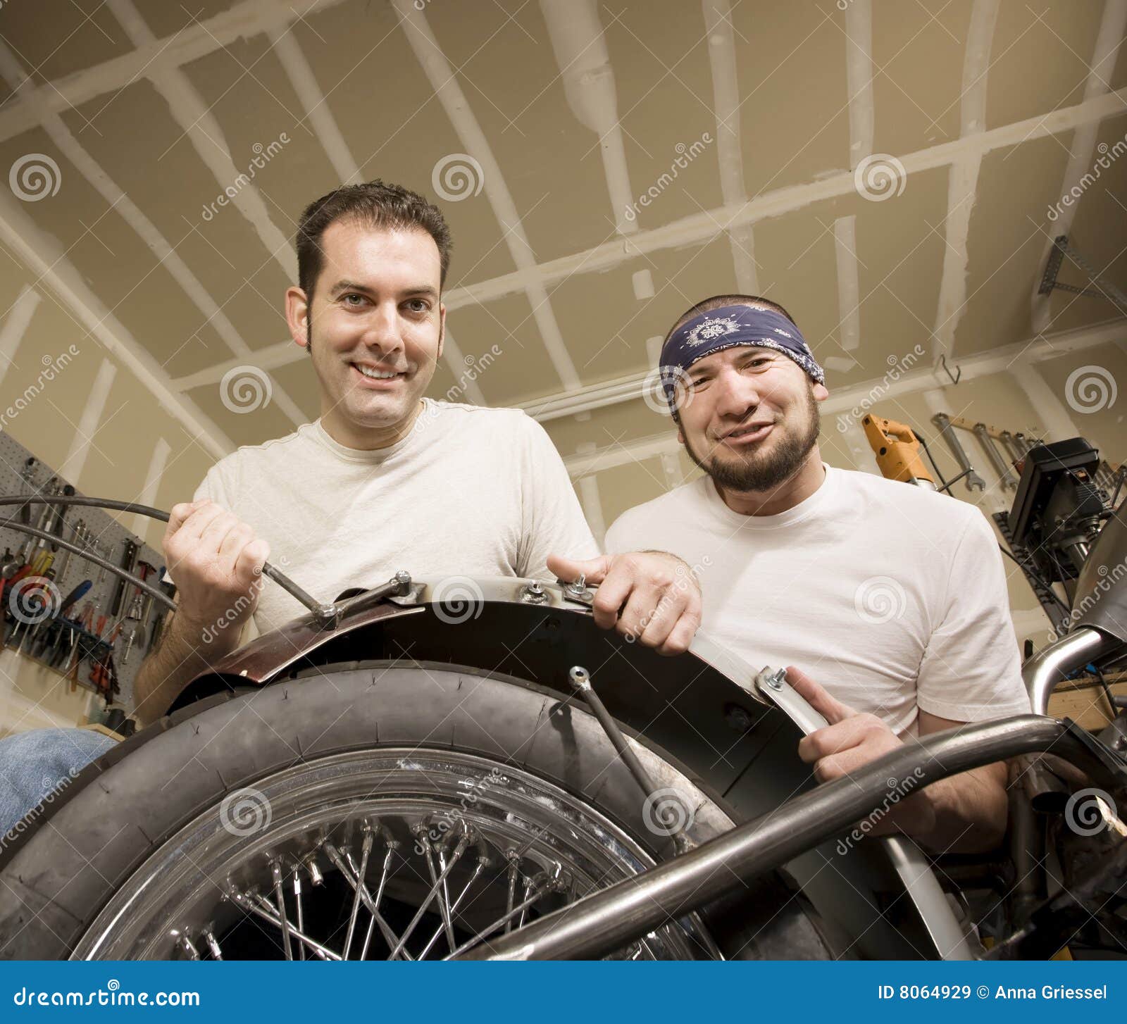 Two Motorcycle Mechanics Placing a Fender Stock Image - Image of ...